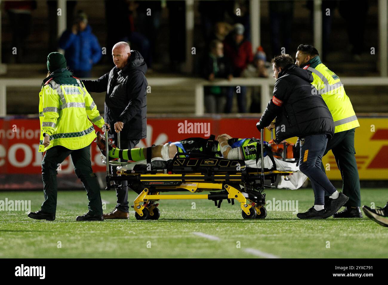 Dragons George Nott is stretched off during the EPCR Challenge Cup ...