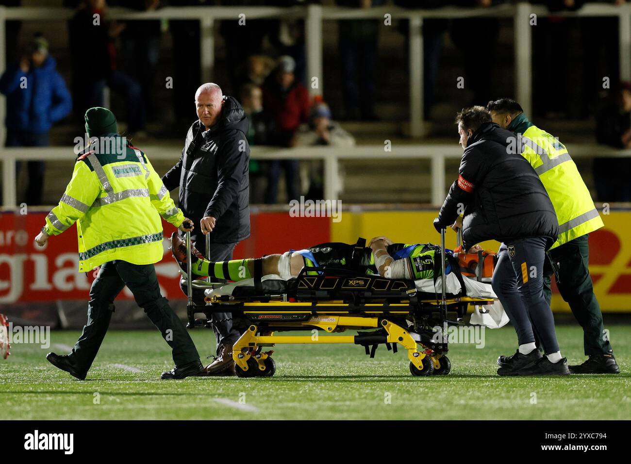 Dragons George Nott is stretched off during the EPCR Challenge Cup ...