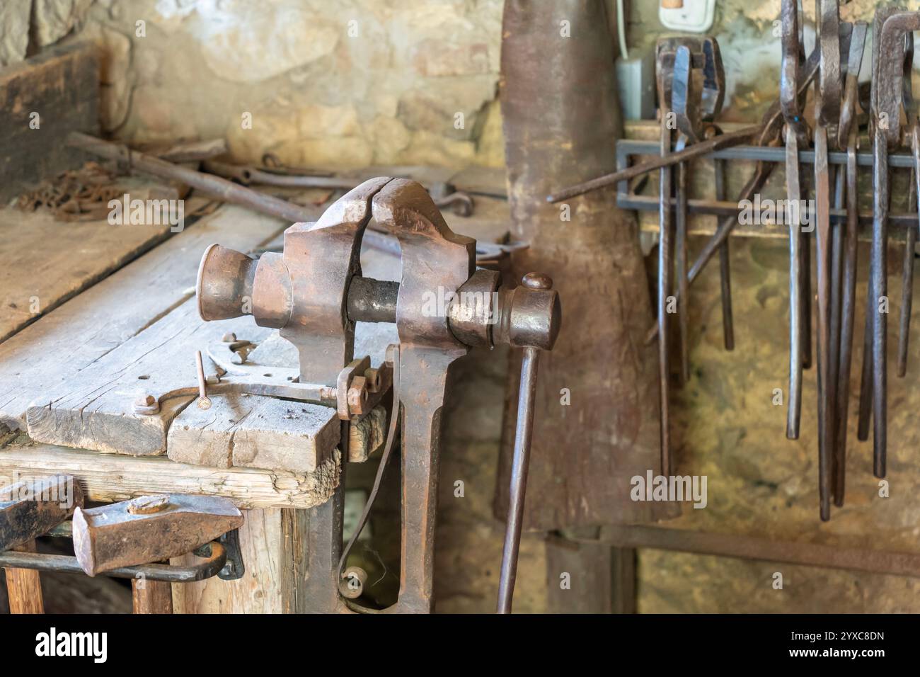 Old iron vice and traditional blacksmith tools in a blacksmith shop Stock Photo - Alamy