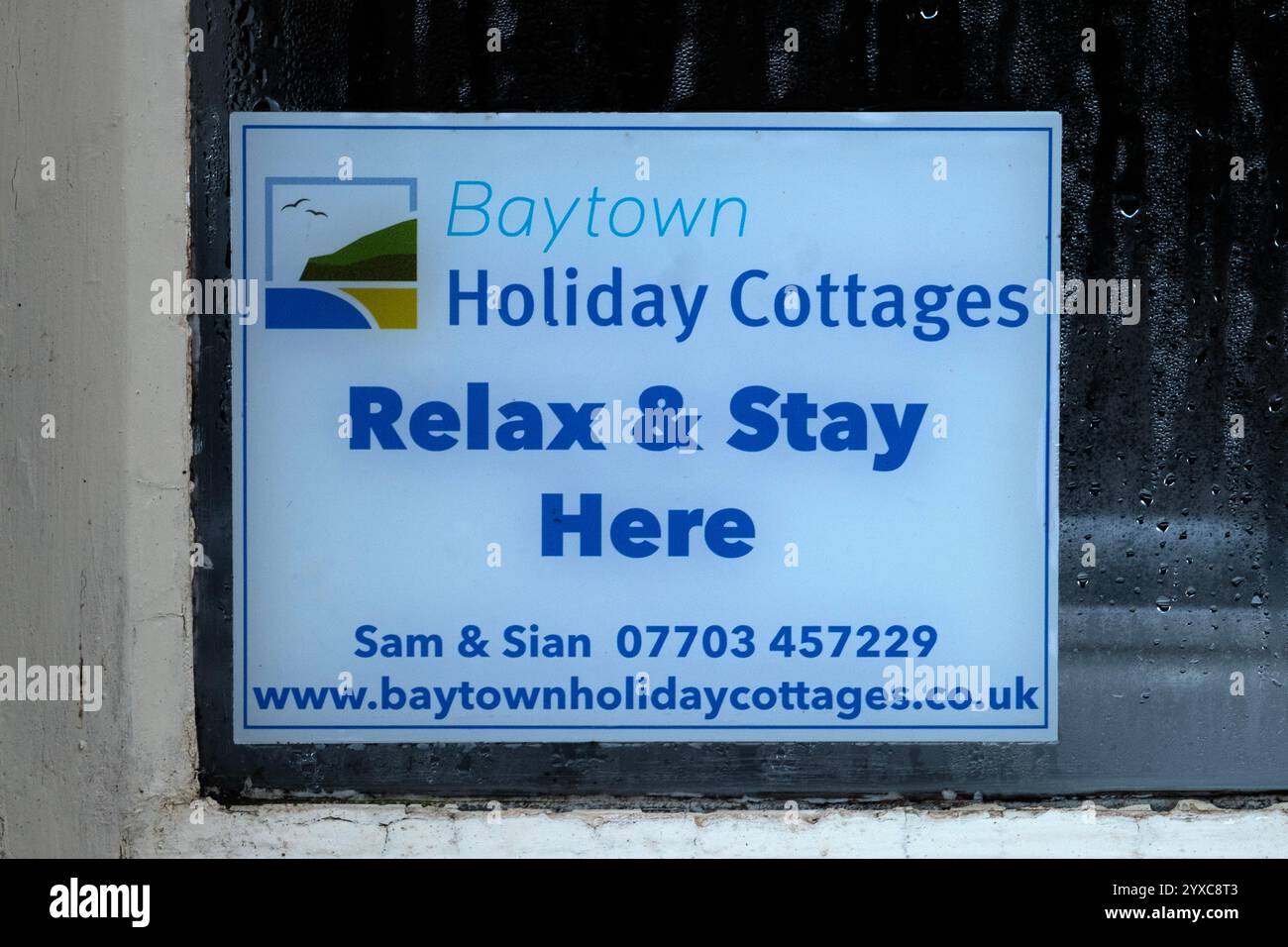 Holiday cottage sign Stock Photo - Alamy