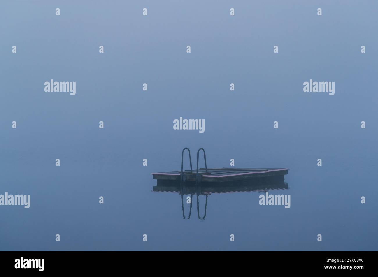 Water still background with swiming raft in calm sea Stock Photo - Alamy