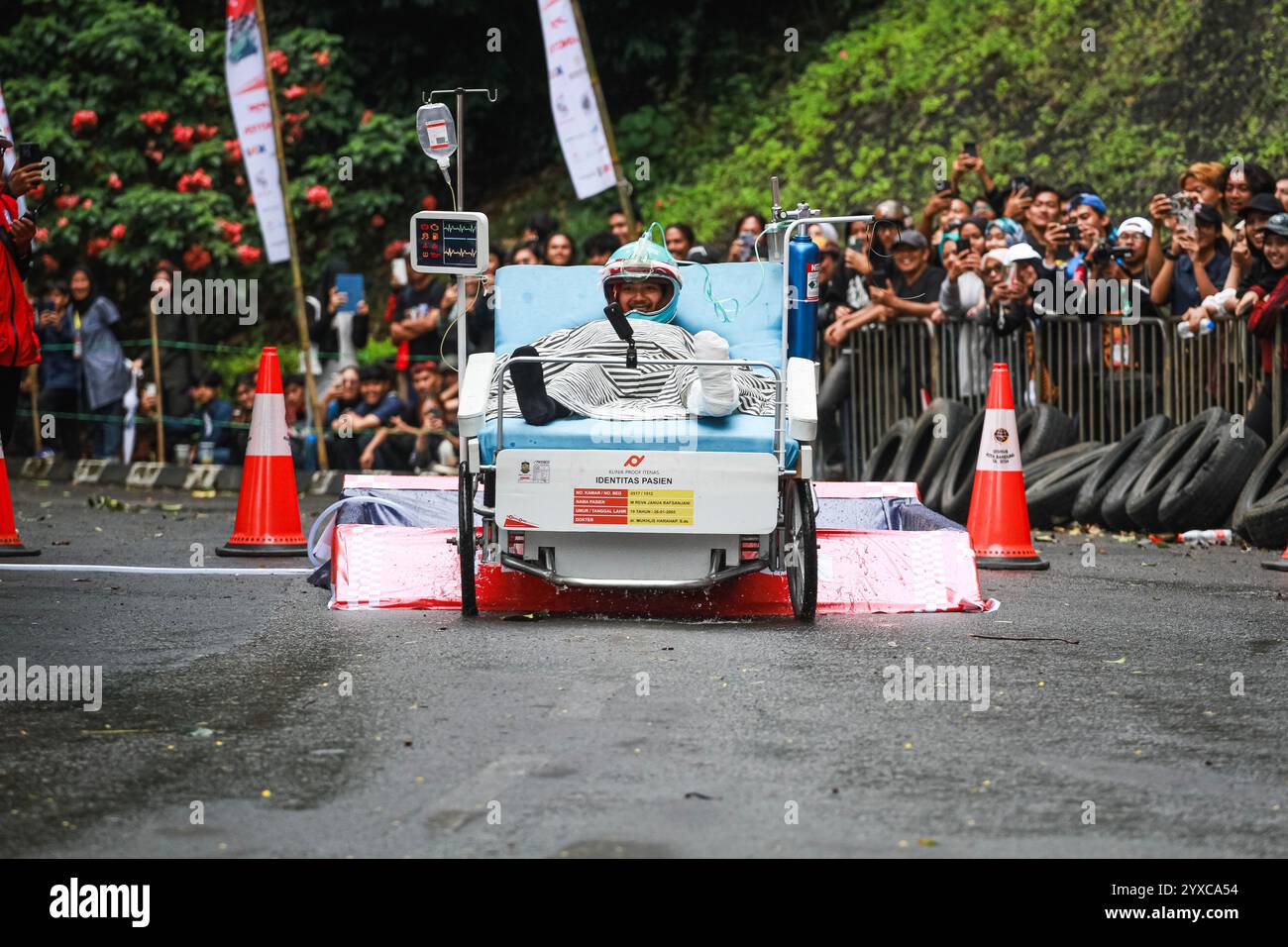 Participants clear the last jump at the Soap Box Derby in Bandung, West ...
