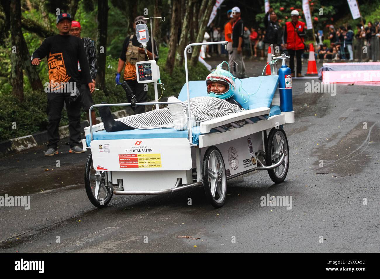 Participants clear the last jump at the Soap Box Derby in Bandung. Over ...