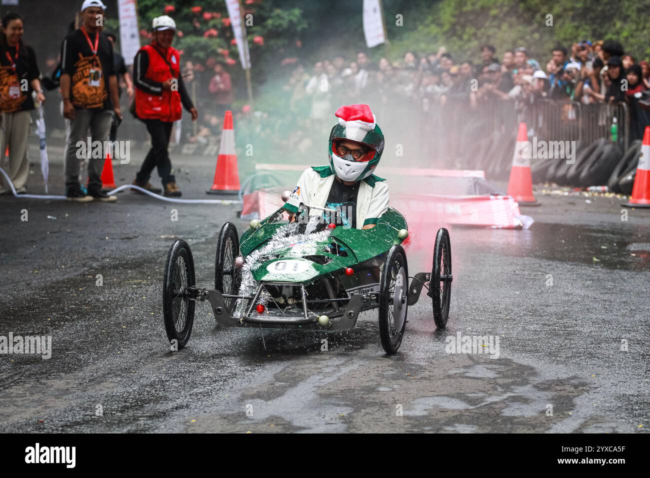Participants clear the last jump at the Soap Box Derby in Bandung, West ...