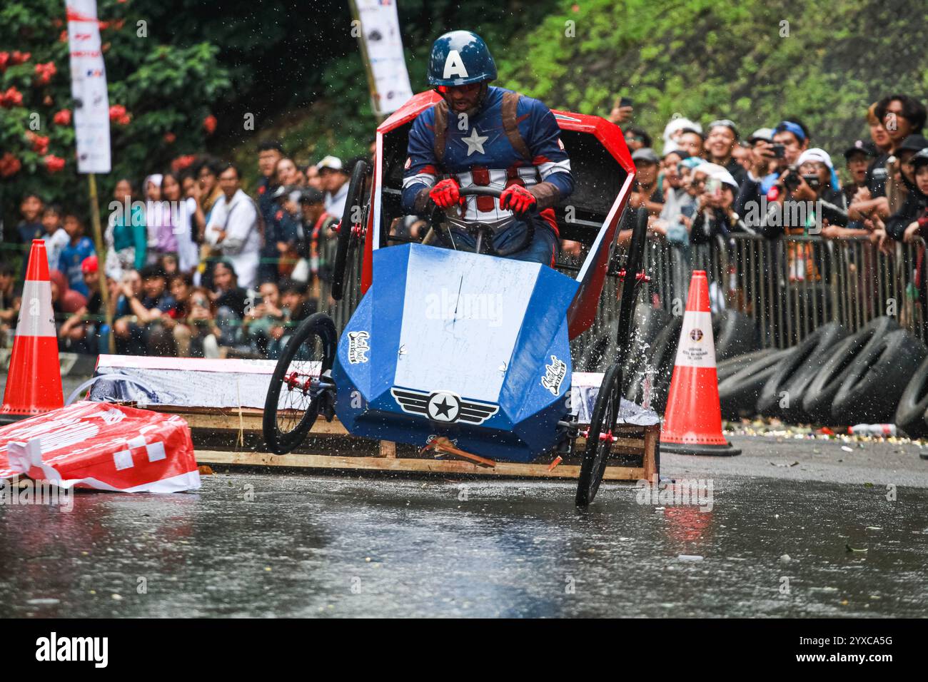 Participants clear the last jump at the Soap Box Derby in Bandung, West ...
