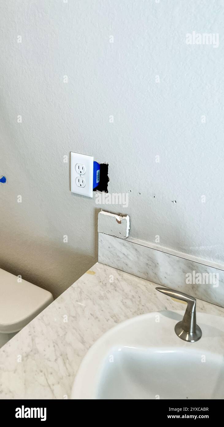 Unfinished Bathroom Wall with Electrical Outlet and Missing Fixture ...