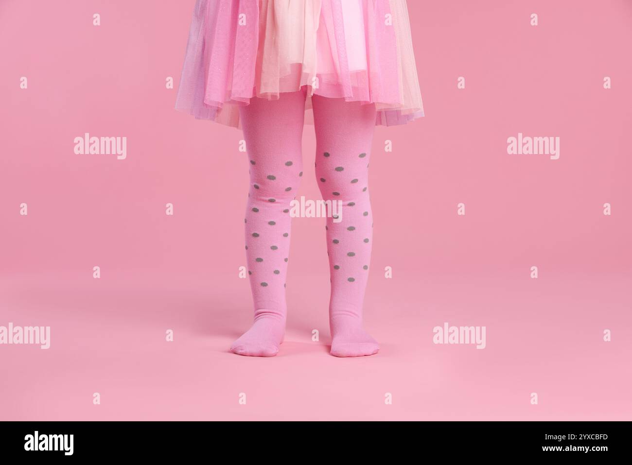 Child wearing tights on pink background, closeup Stock Photo - Alamy