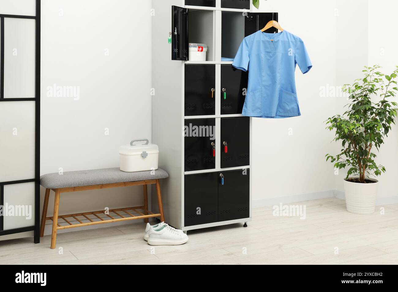Medical personnel uniform on locker in changing room Stock Photo - Alamy