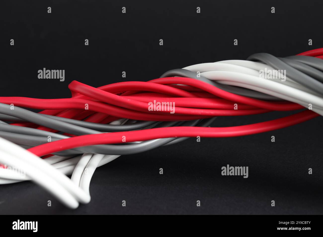 Many electrical wires on black background, closeup Stock Photo - Alamy