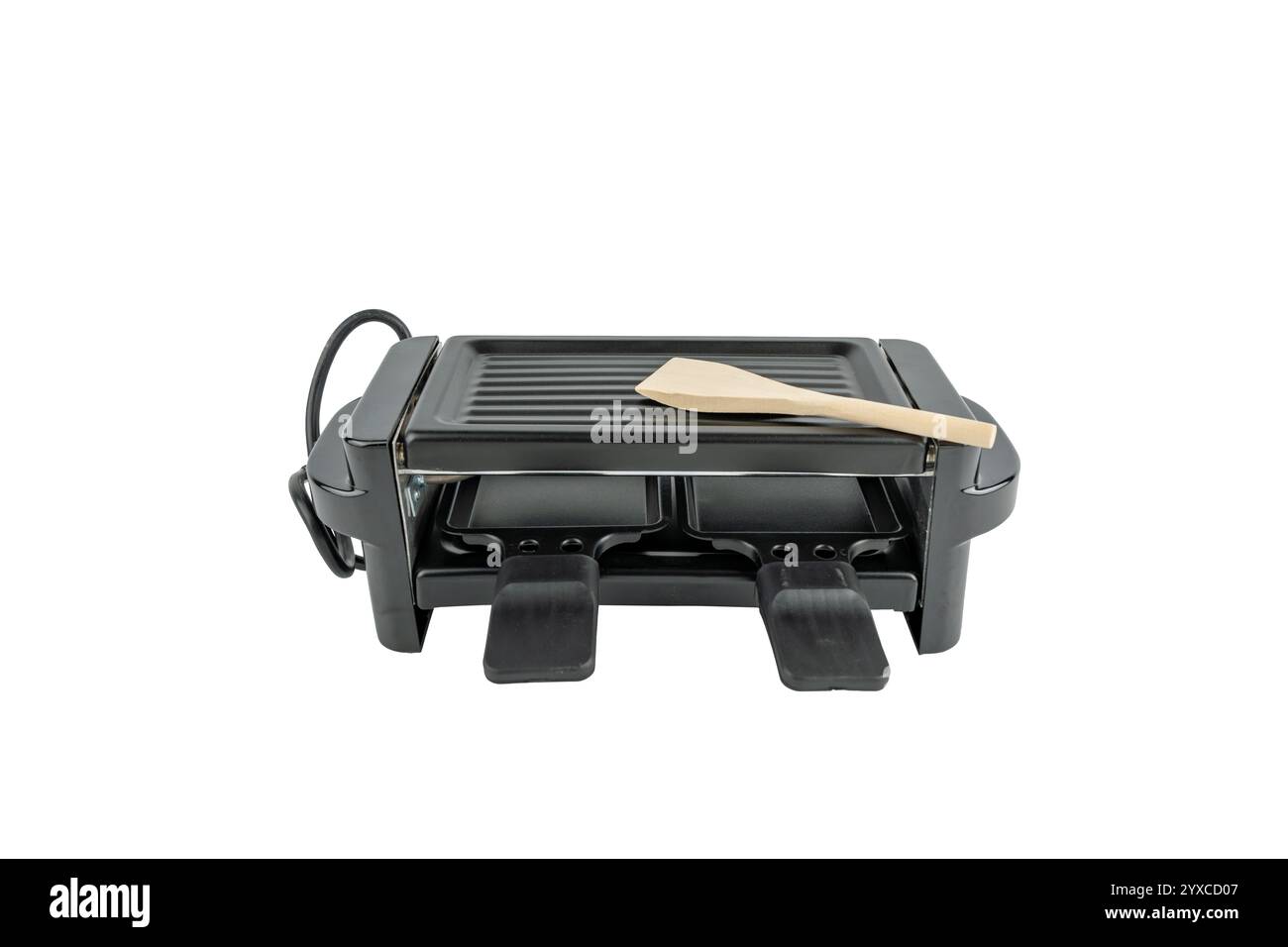 Electric raclette grill used to prepare processed cheese. Isolated on a ...