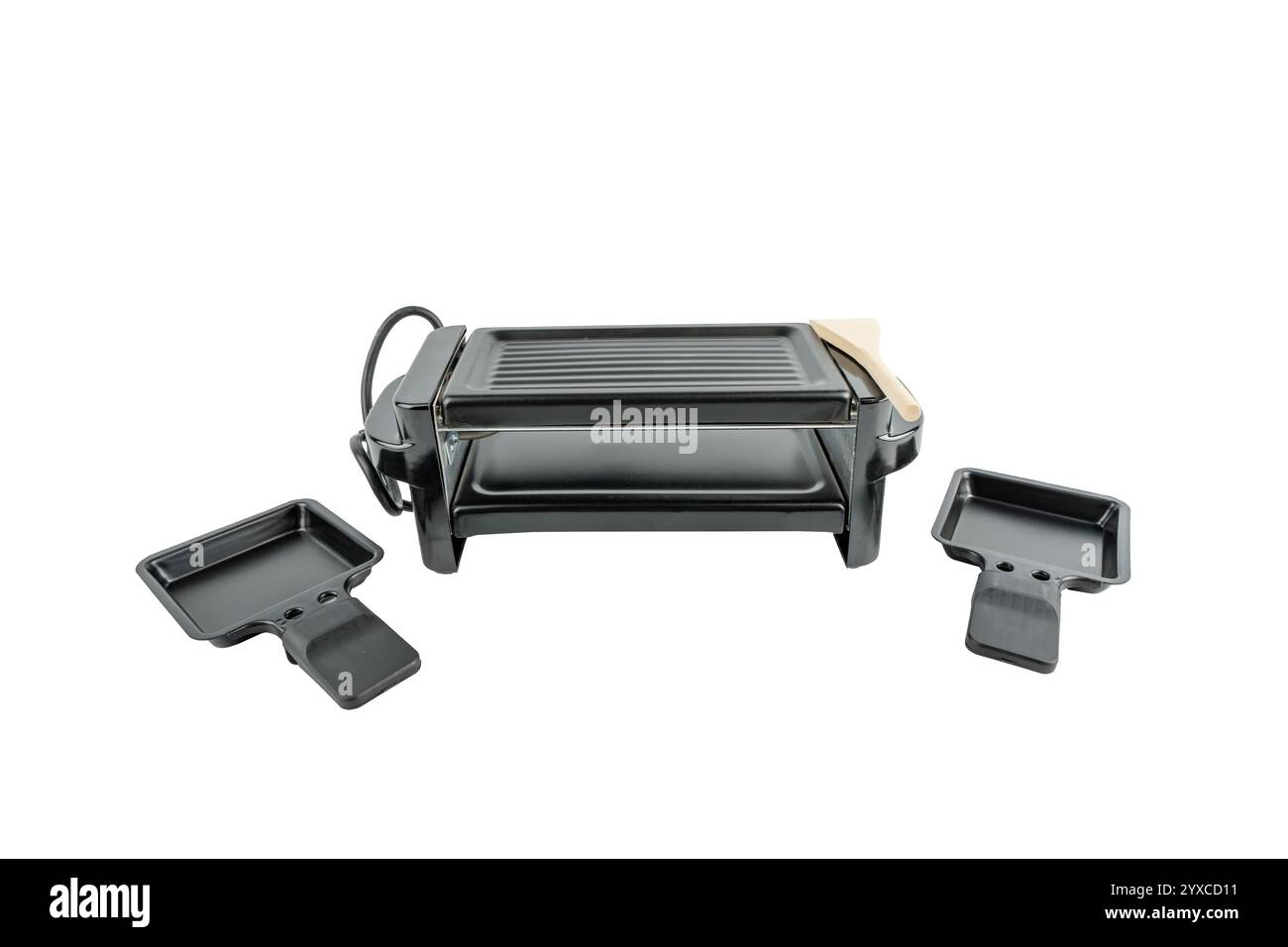 Electric raclette grill used to prepare processed cheese. Isolated on a ...