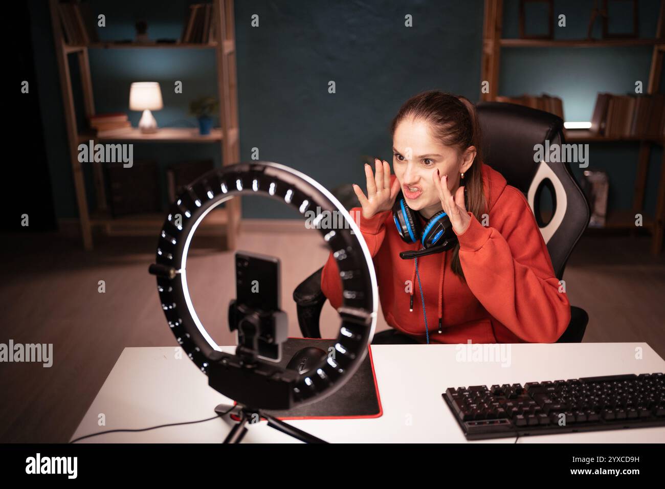 Woman gamer blogger influencer streaming live with her subscribers ...