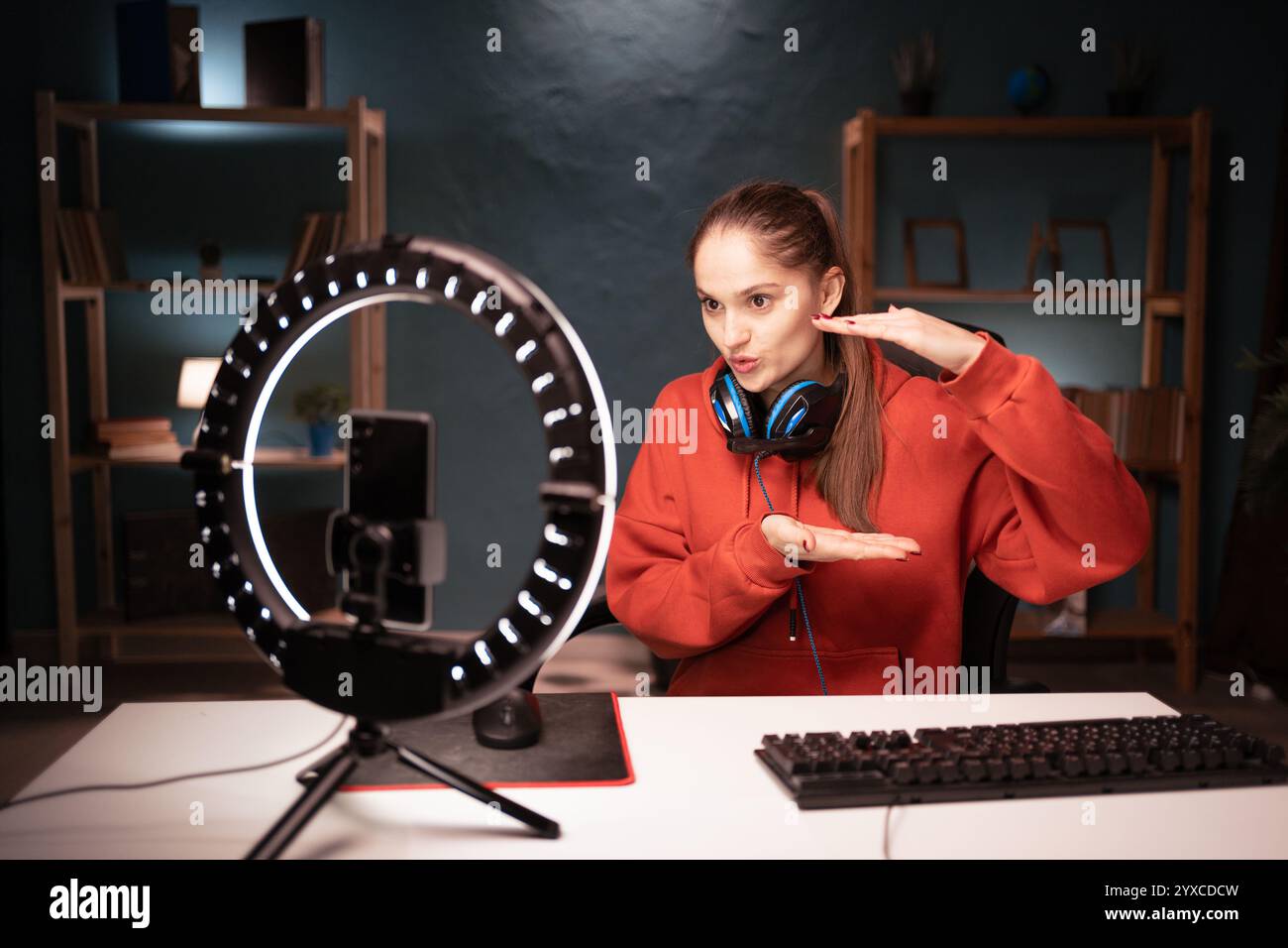 Woman gamer blogger influencer streaming live with her subscribers ...