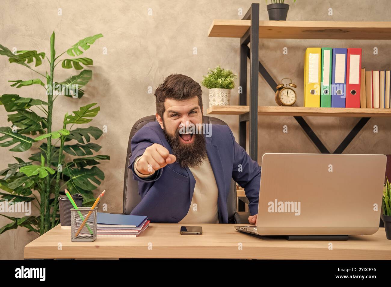 Shaking fist at somebody. Angry boss yelling at office desk. Work ...