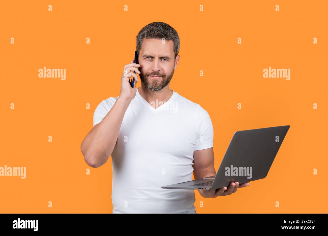 cheerful multitasking freelancing man with phone. multitasking man ...