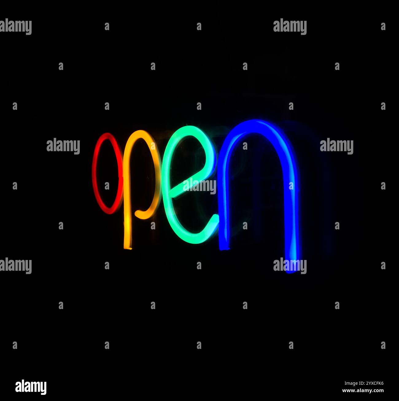A vibrant neon "open" sign with red, yellow, green, and blue glowing ...
