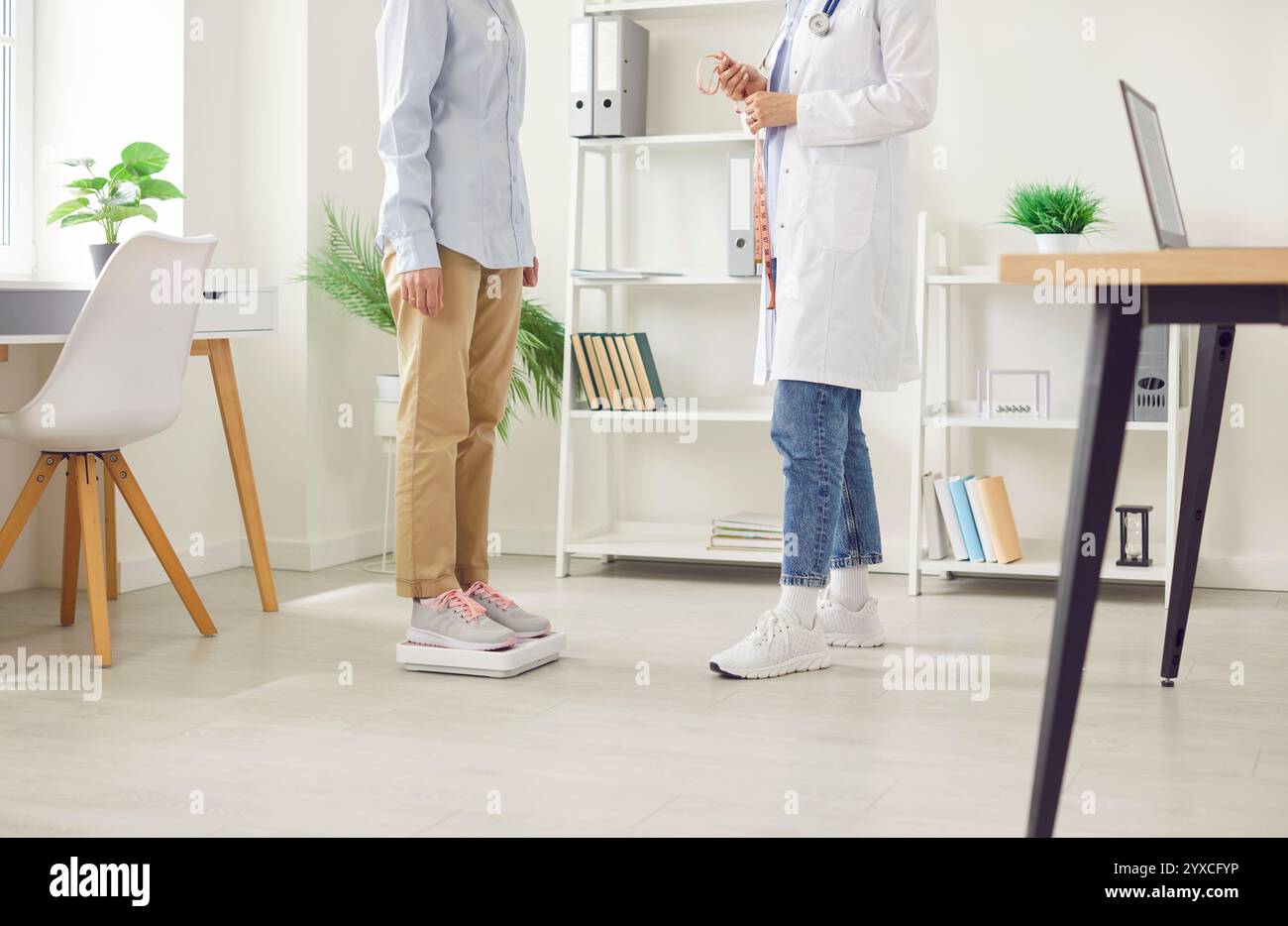 Patient Weighing on Scale During Doctor or Nurse Visit Stock Photo - Alamy