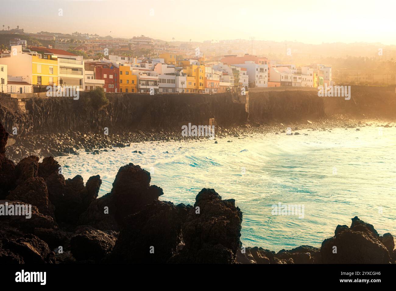 Colorful buildings on ocean coastline during moody sunset, Porto de la ...