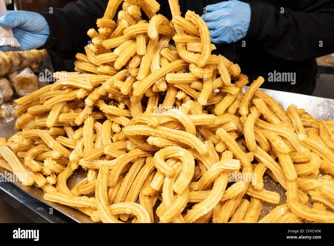 Close-up of a stack of churros for sale at a street food stall Stock ...