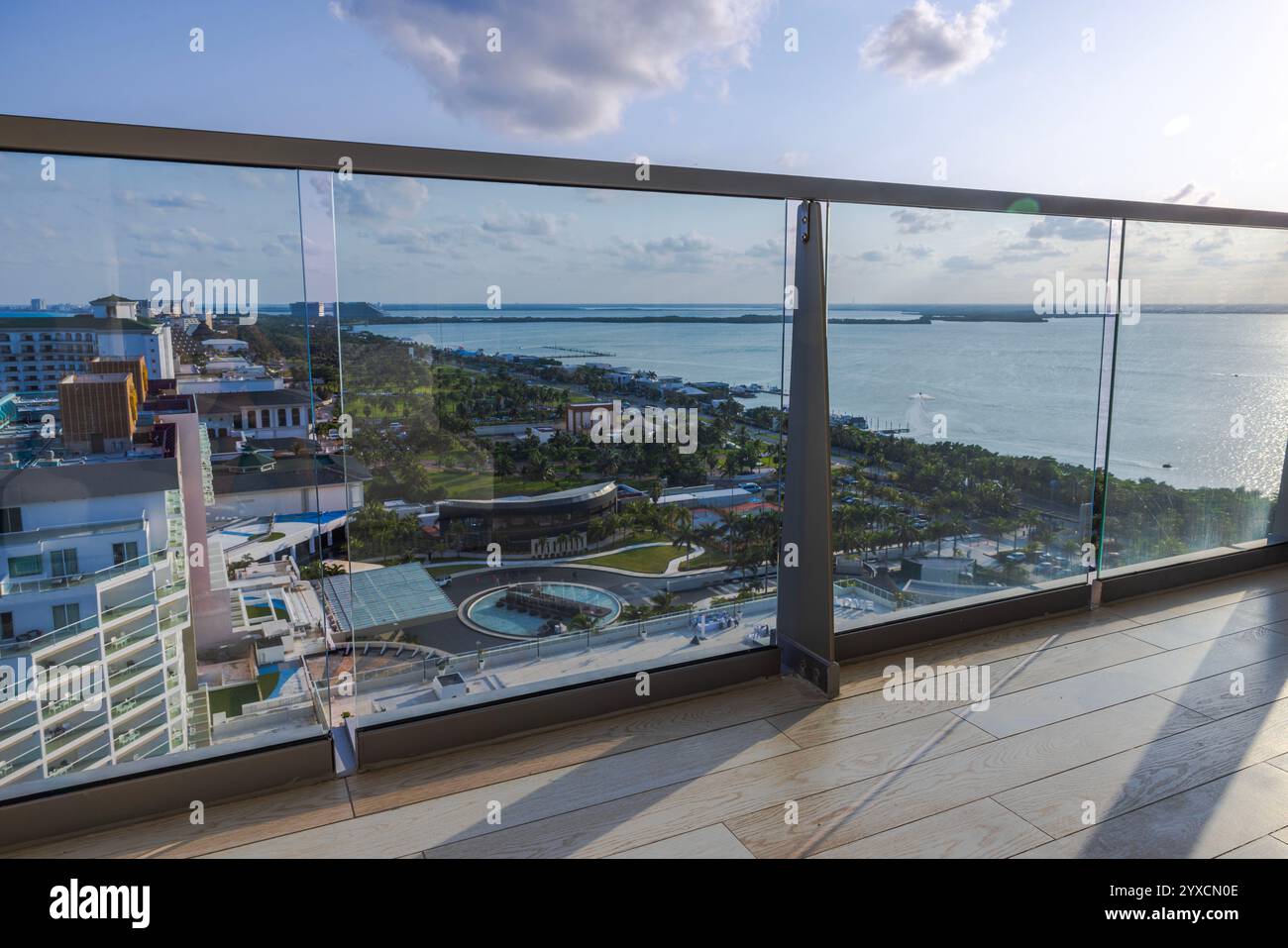 Panoramic view of tropical coastline from modern balcony with glass ...