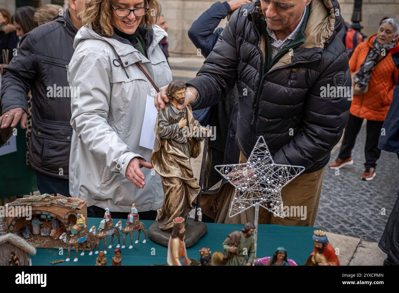 December 15, 2024, Barcelona, Spain: A man is seen adding a large ...