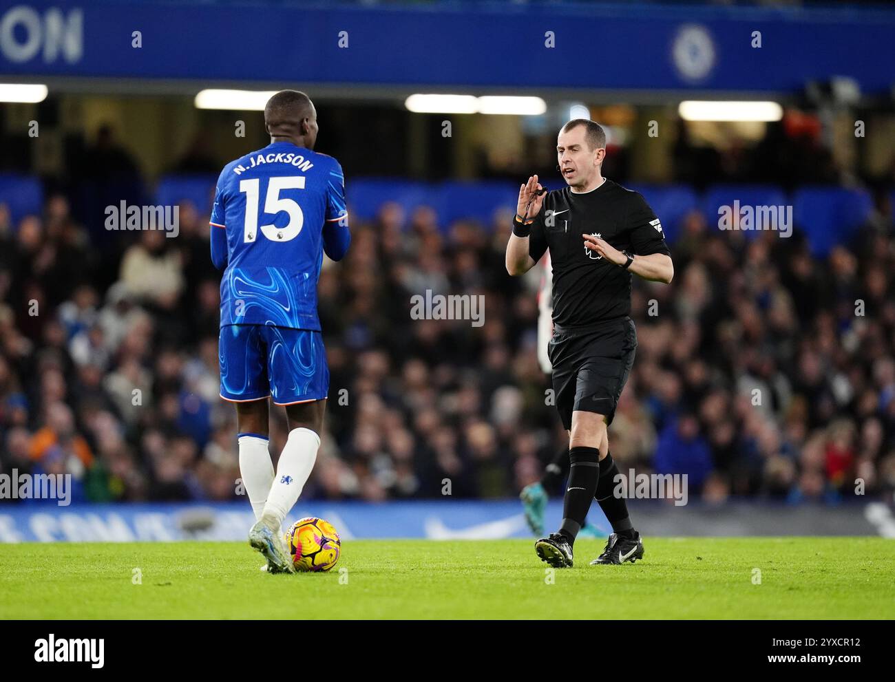 Chelsea's Nicolas Jackson (left) and referee Peter Bankes during the ...