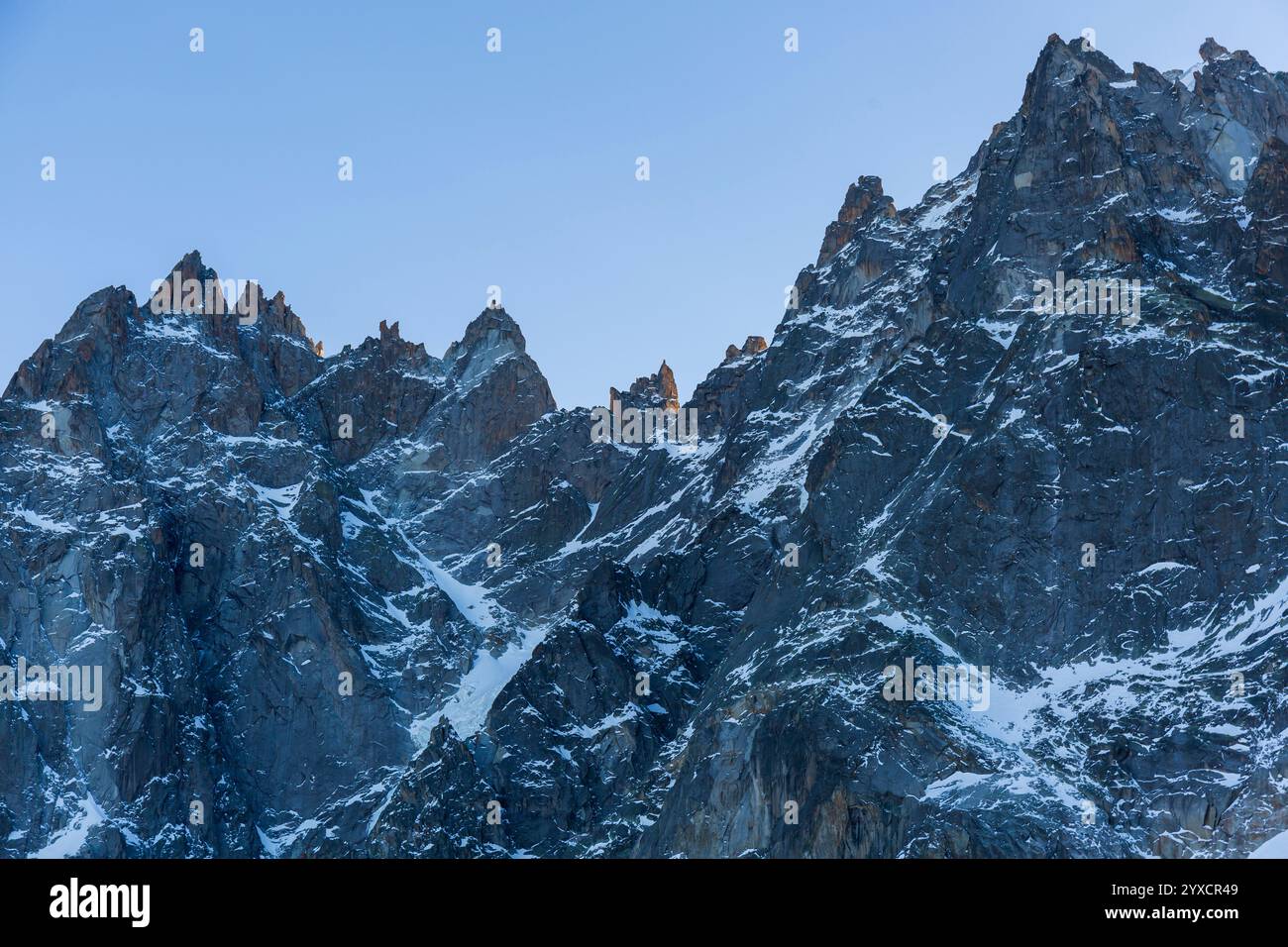 Towering rugged peaks around Chamonix with snow-covered mountains under ...