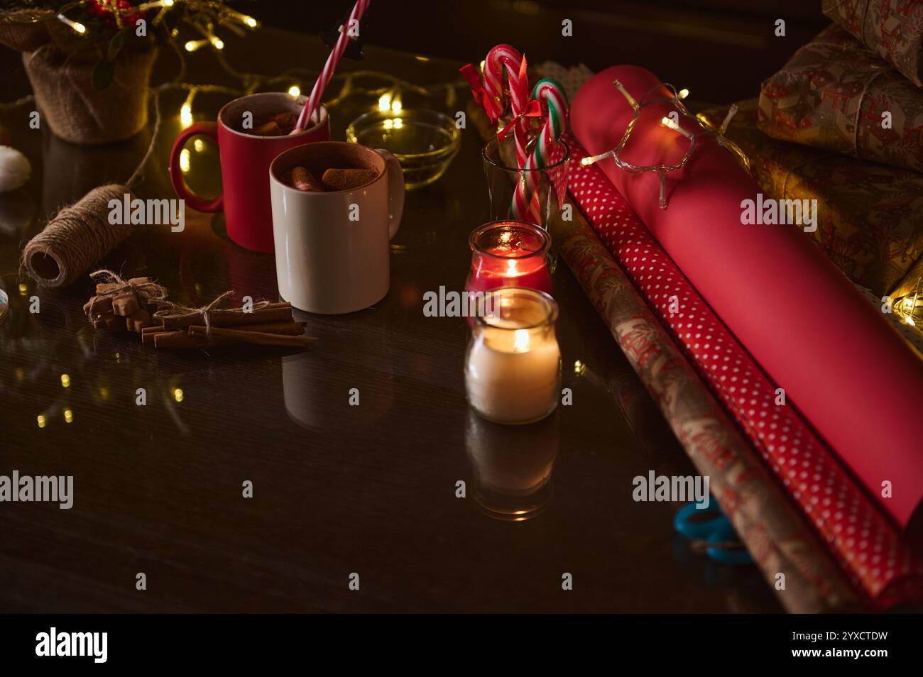 Warm and cozy holiday atmosphere featuring hot chocolate, candles ...