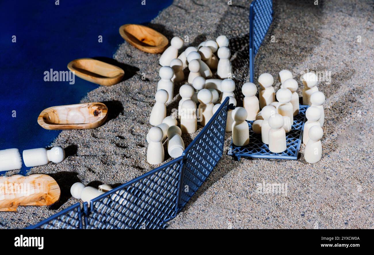 Migration symbolism: Figurines and boats by a shoreline Stock Photo - Alamy