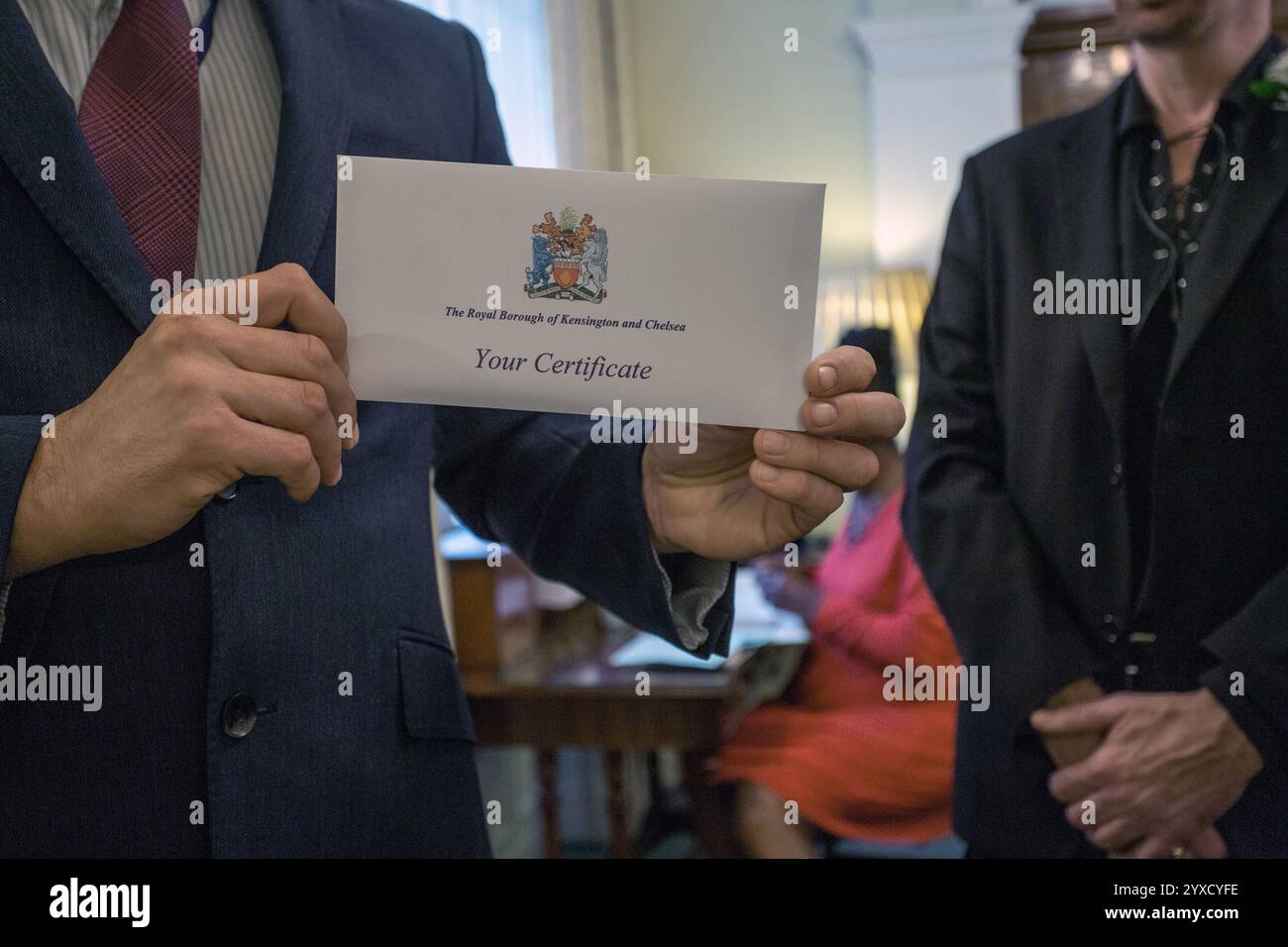 Unrecognisable person holding a wedding certificate envelope from the ...