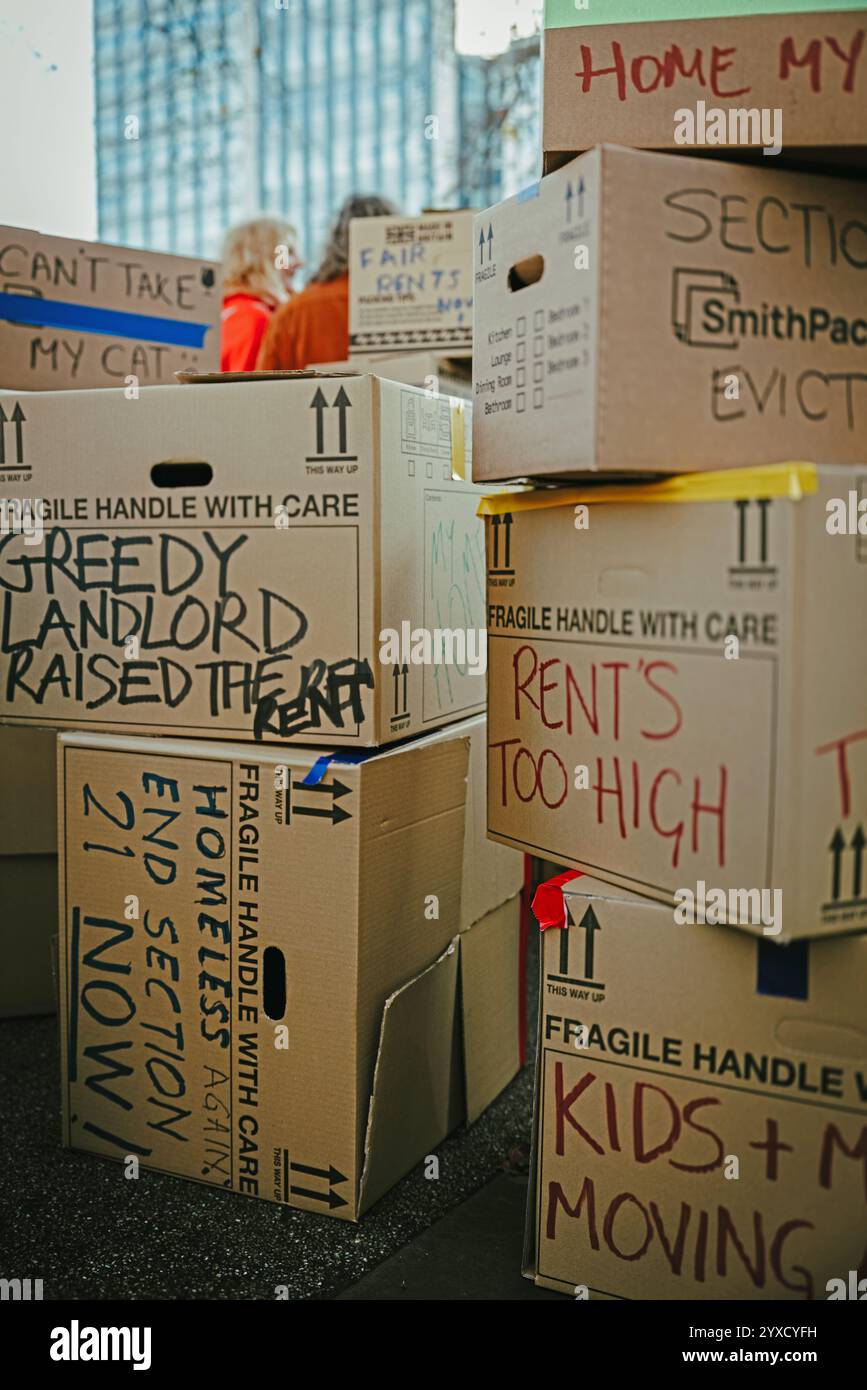 Protesters mark boxes with slogans in Cavendish Square as renters stage ...
