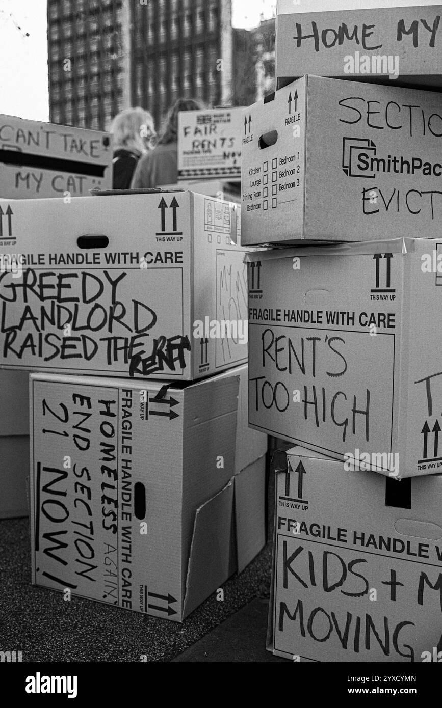 Protesters mark boxes with slogans in Cavendish Square as renters stage ...
