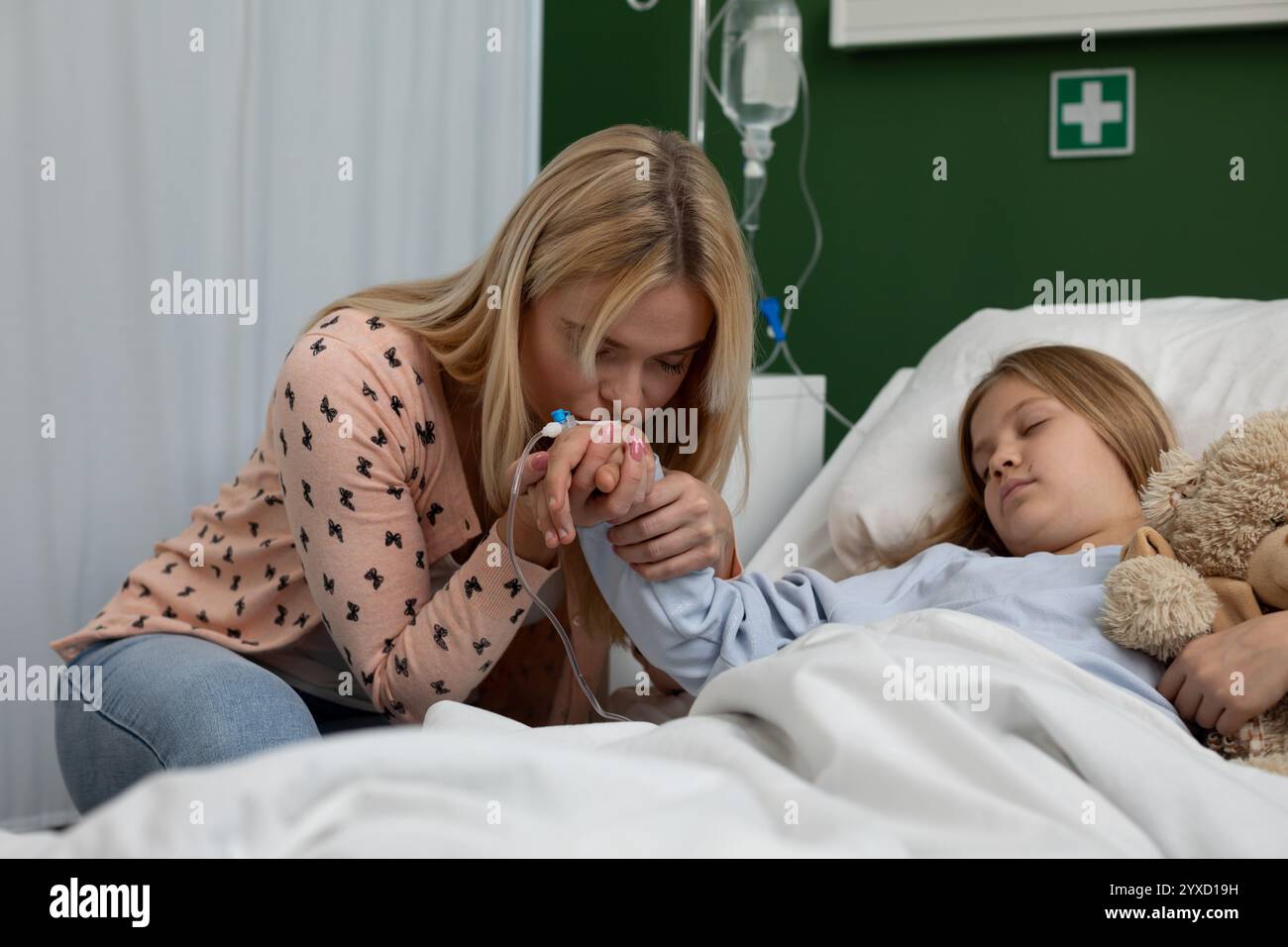 A Caring Mother Nurtures Her Sick Child in a Hospital Environment Full ...