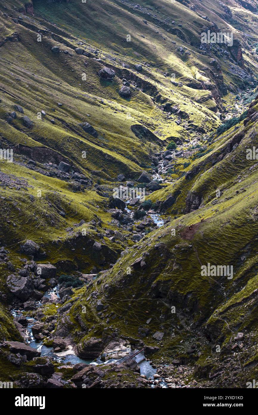 An epic view of a huge mountain rift, the terrain is covered with ...