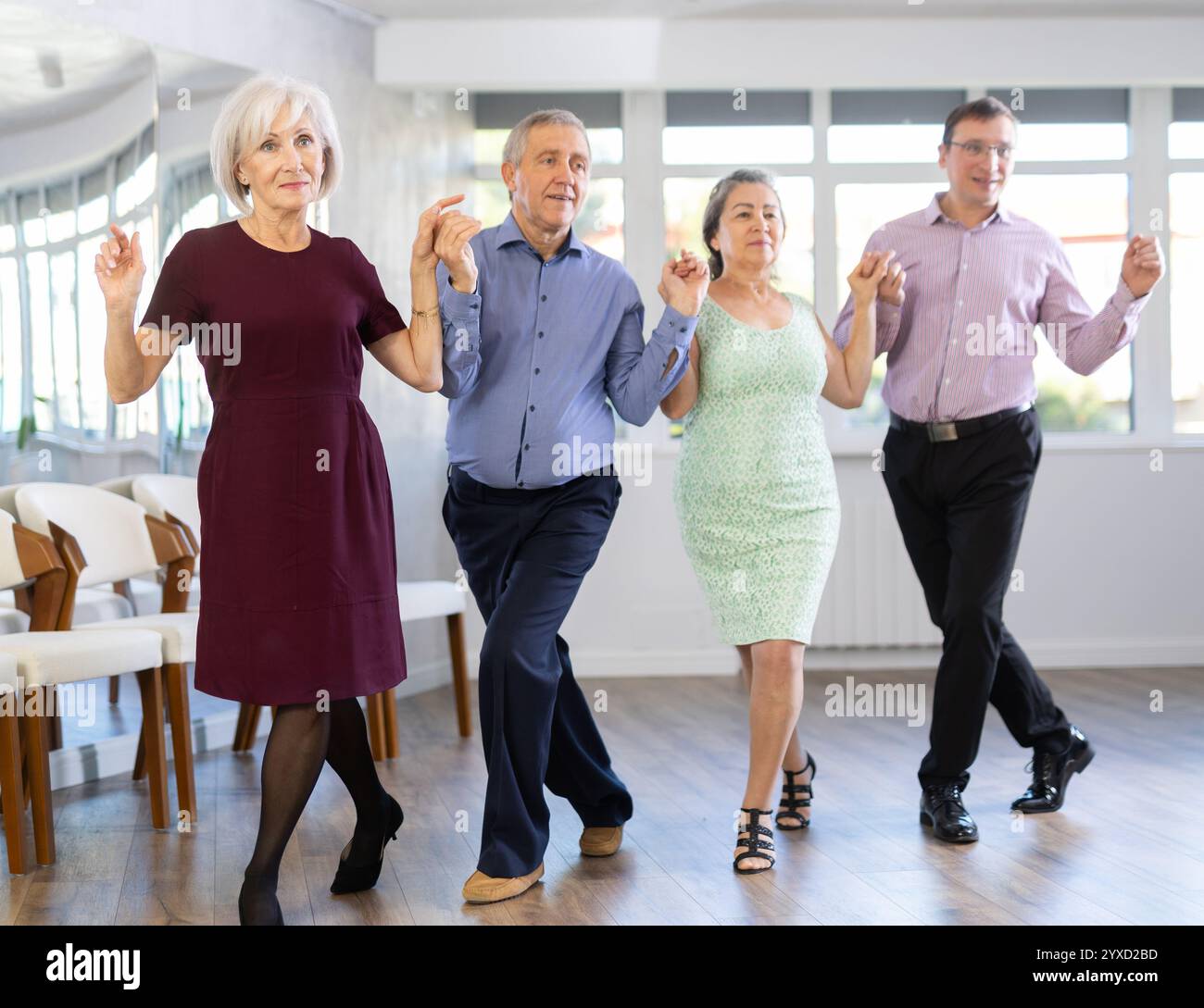 Group of men and women dancing folk dance Stock Photo - Alamy
