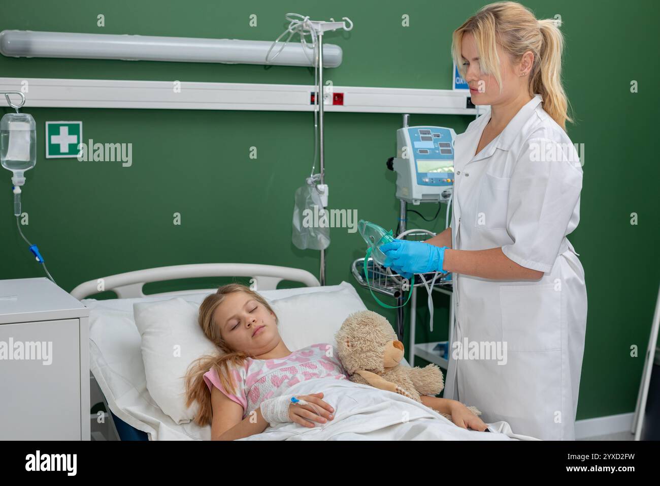 A nurse provides attentive care for a child in the hospital, monitoring ...