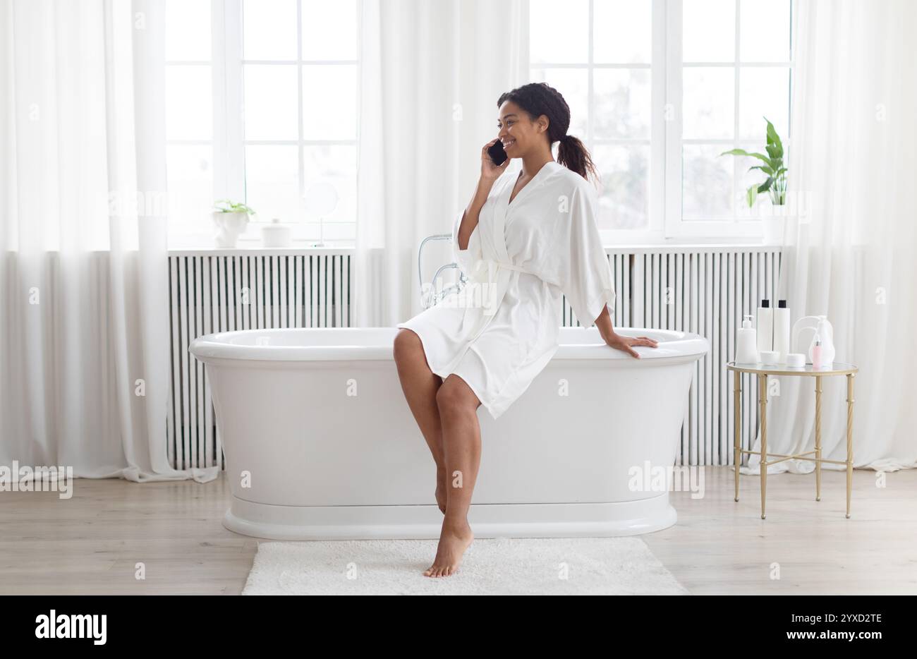 Relaxing in the bathroom while enjoying self-care and beauty routines ...