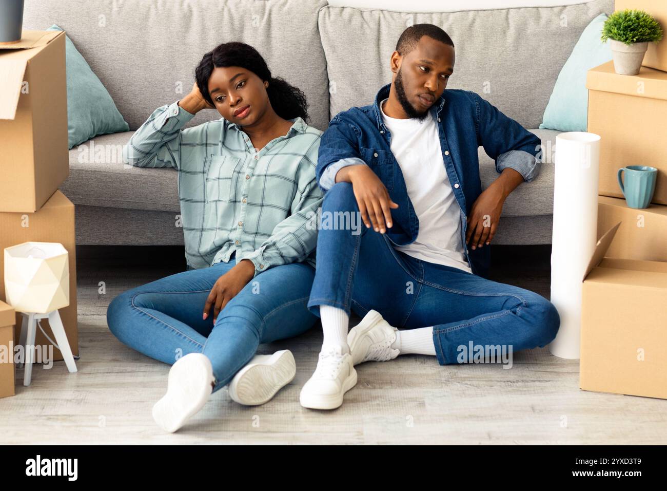 Portrait Of Tired Black Couple Sitting On Floor Exhausted After Moving ...