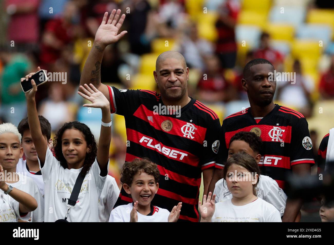 Brazilian former soccer player Adriano waves to fans before his ...