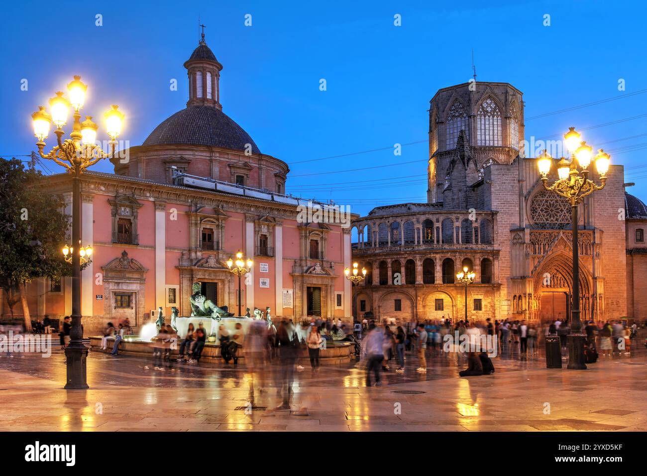 Twilight in the charming Plaza de la Virgen in Valencia, Spain. Build ...
