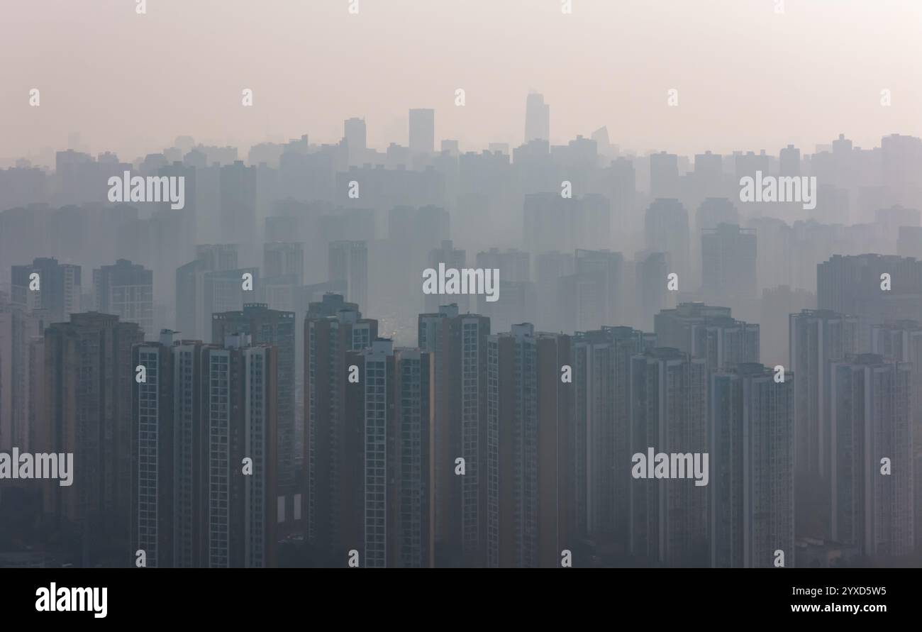 High-rise buildings are seen in downtown Chongqing, China, December 15 ...