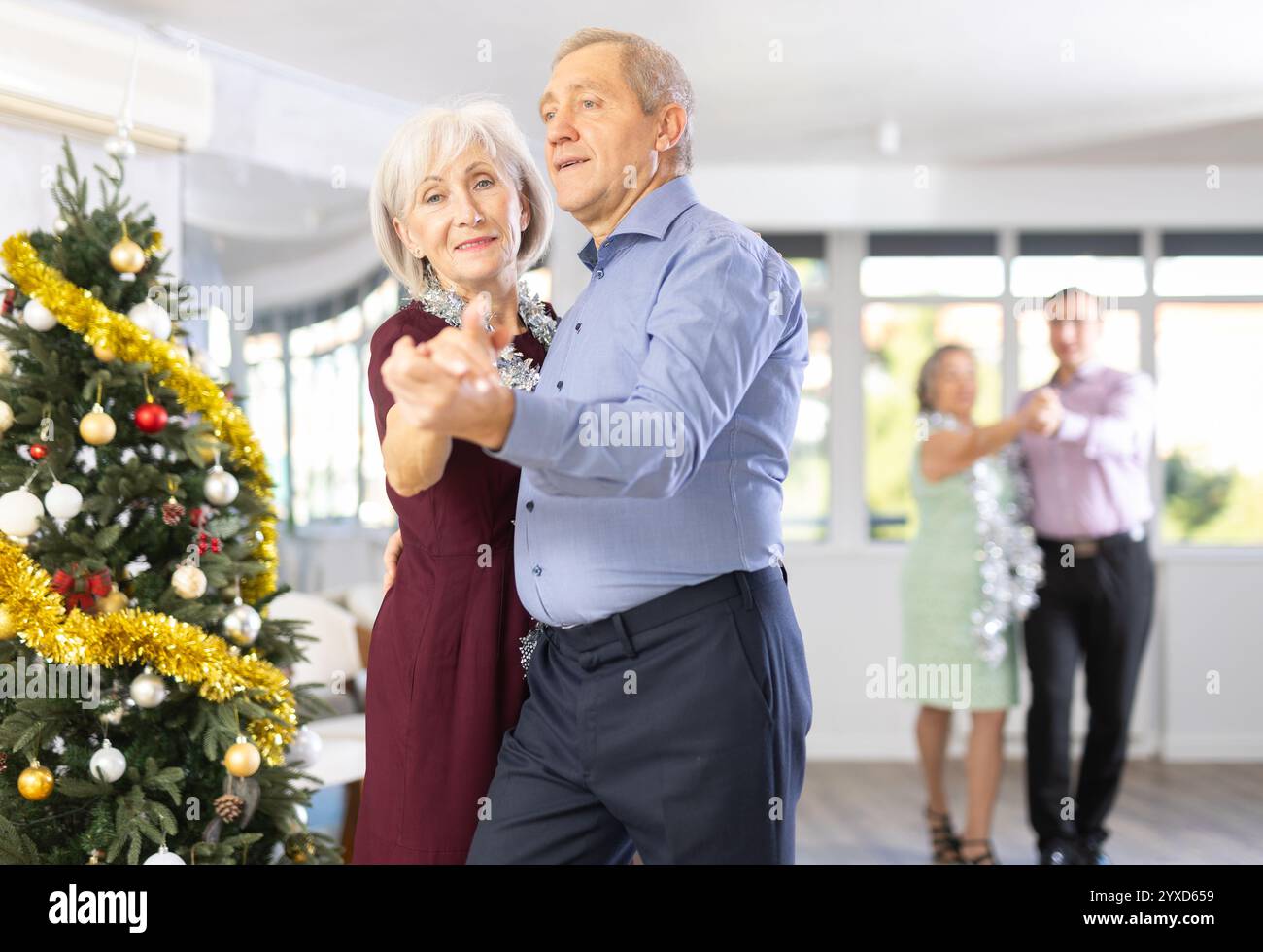 Elderly couple dancing slow dance and enjoying each other at dance ...
