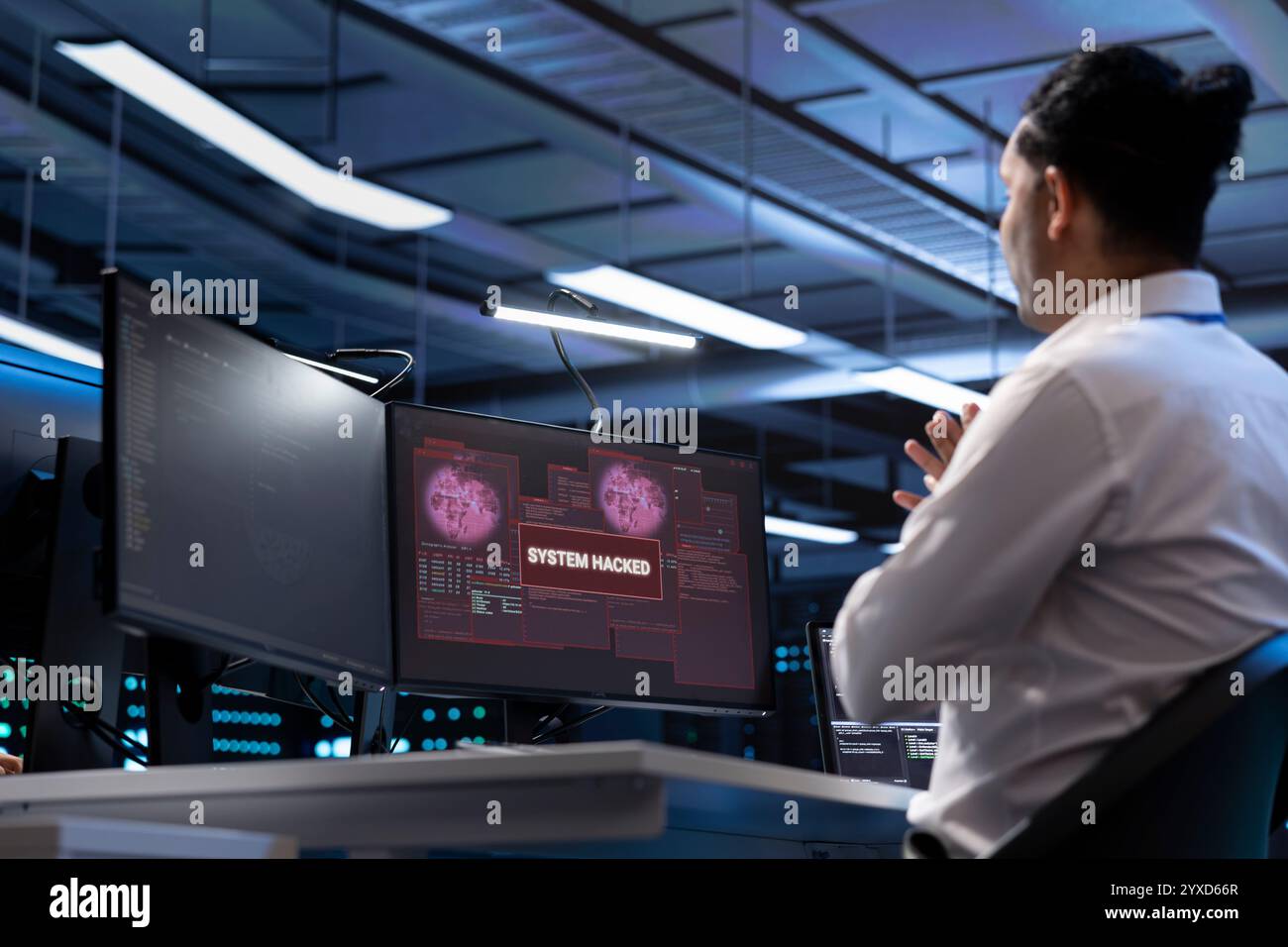 Panicked system administrator in data hi-res stock photography and ...