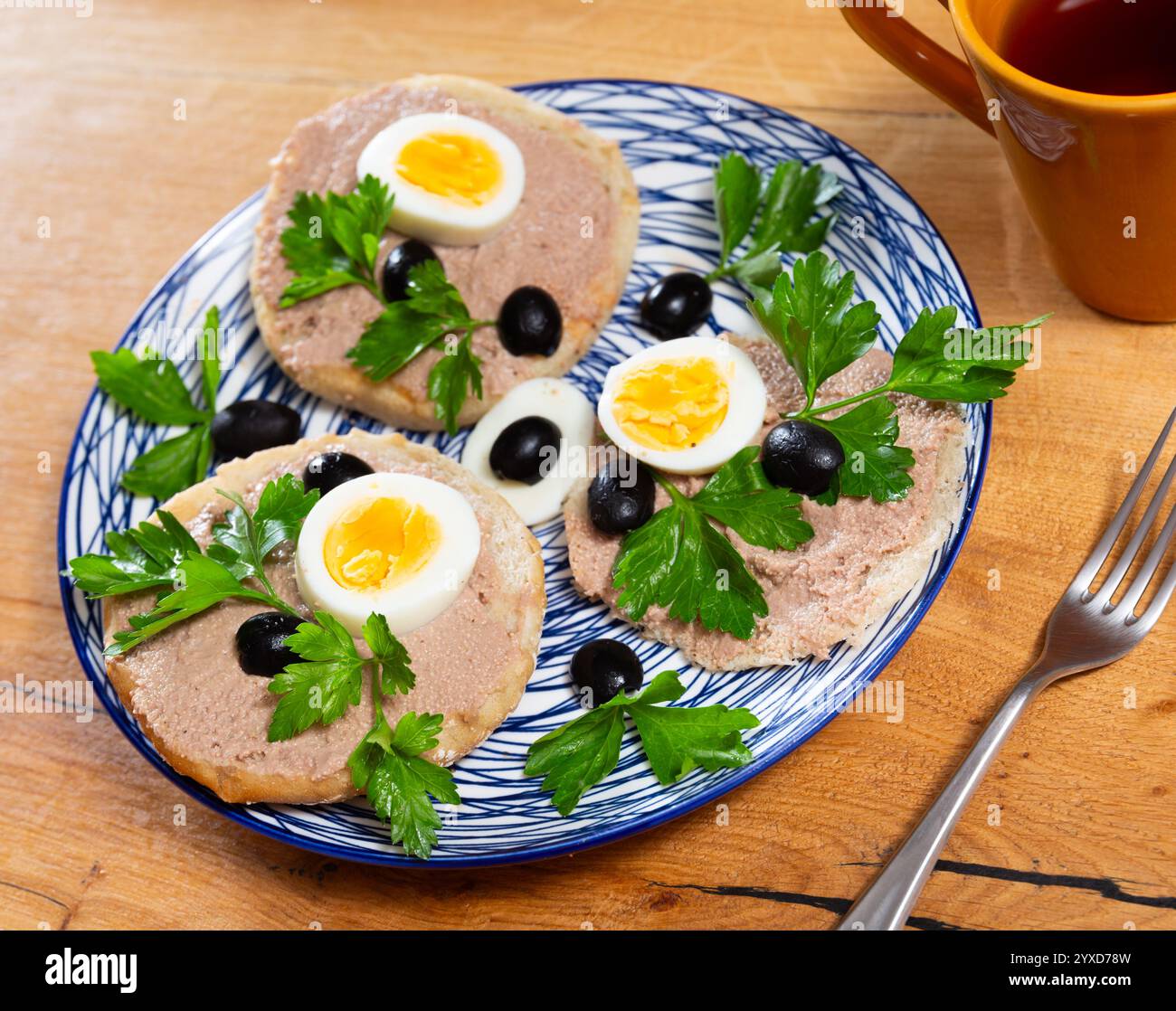 Sandwiches with pollock liver and roe pate, egg, olives Stock Photo - Alamy