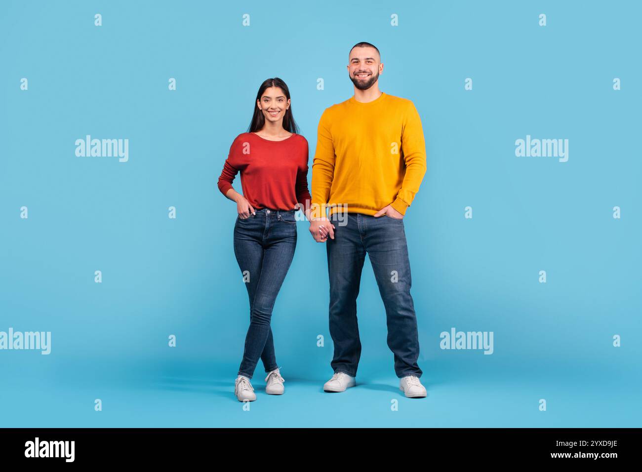 Couple expressing love and connection against a bright blue background ...