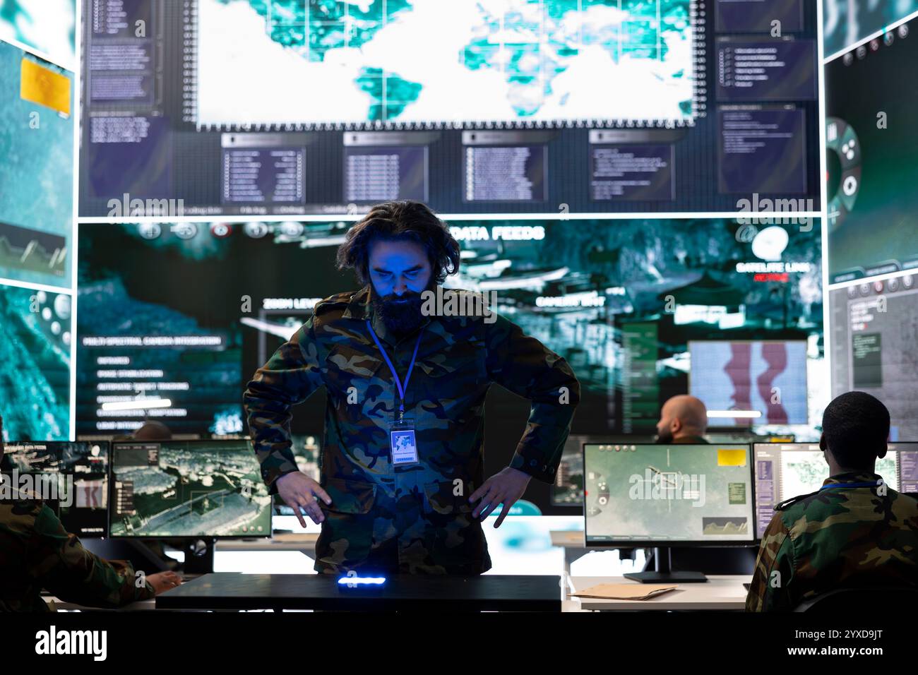 Army conscript examines satellite data on a hologram projection ...