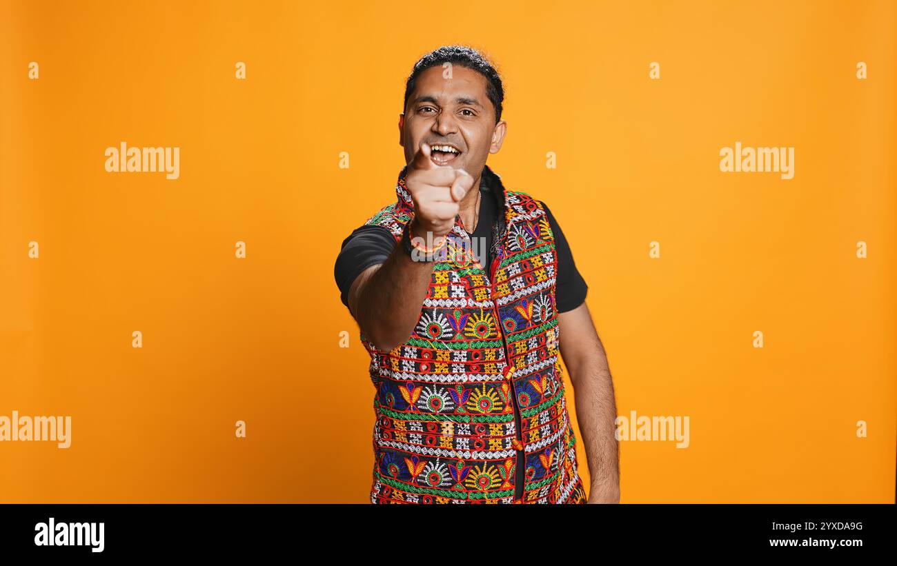 Portrait of narcissistic cheerful indian man celebrating and bragging ...