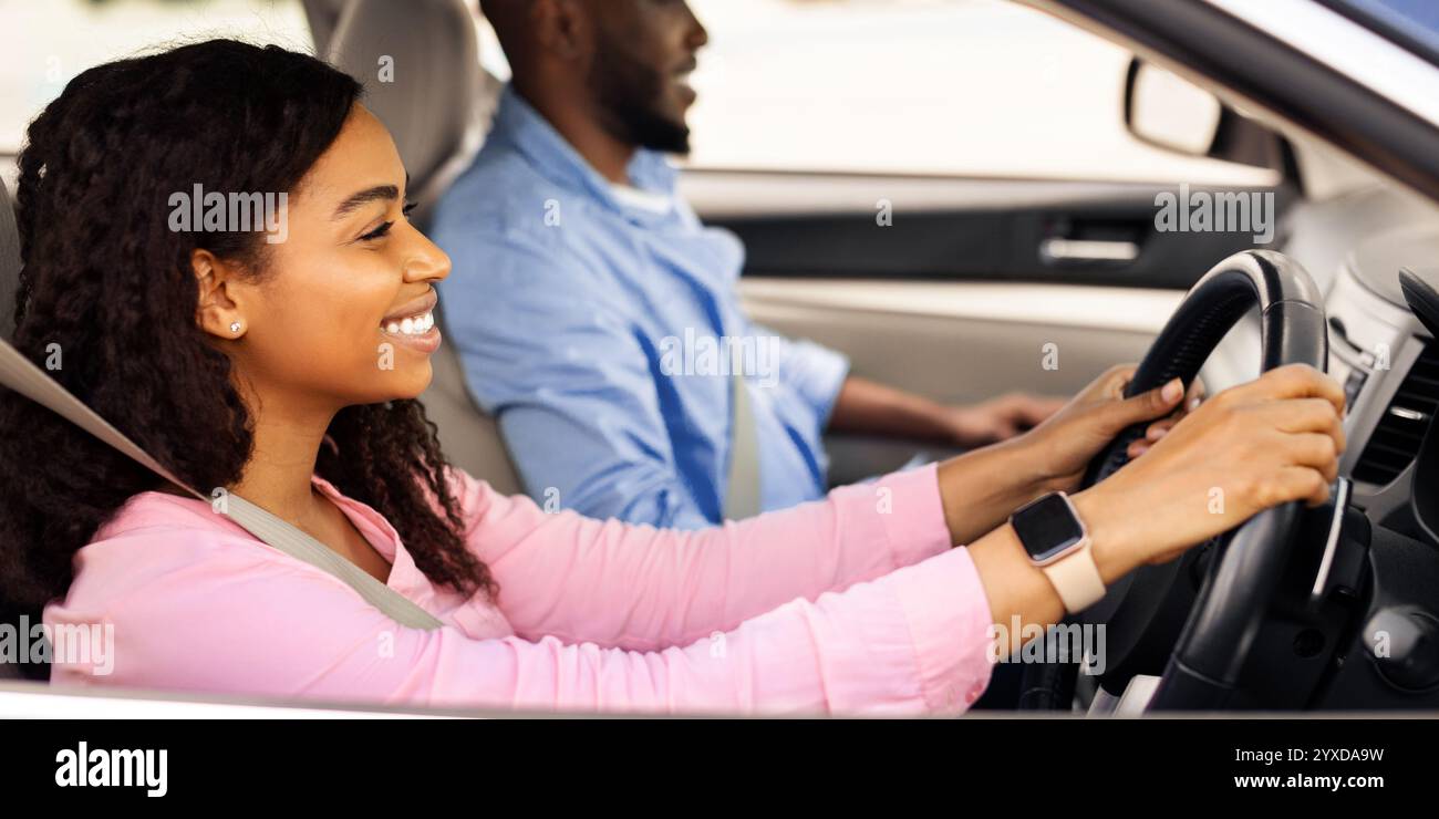 Happy black couple enjoying long drive on a car Stock Photo - Alamy
