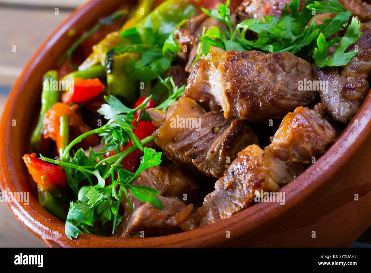 Tasty dish ghiveci of bulgarian cuisine of beef with paprika at clay ...