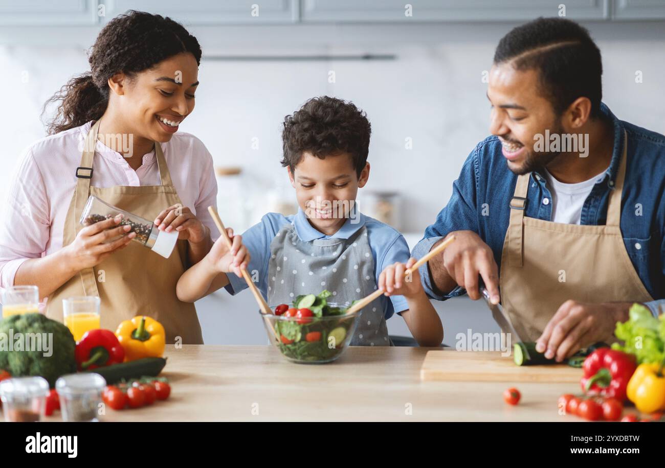Family cooking together in a joyful kitchen setting with fresh ...
